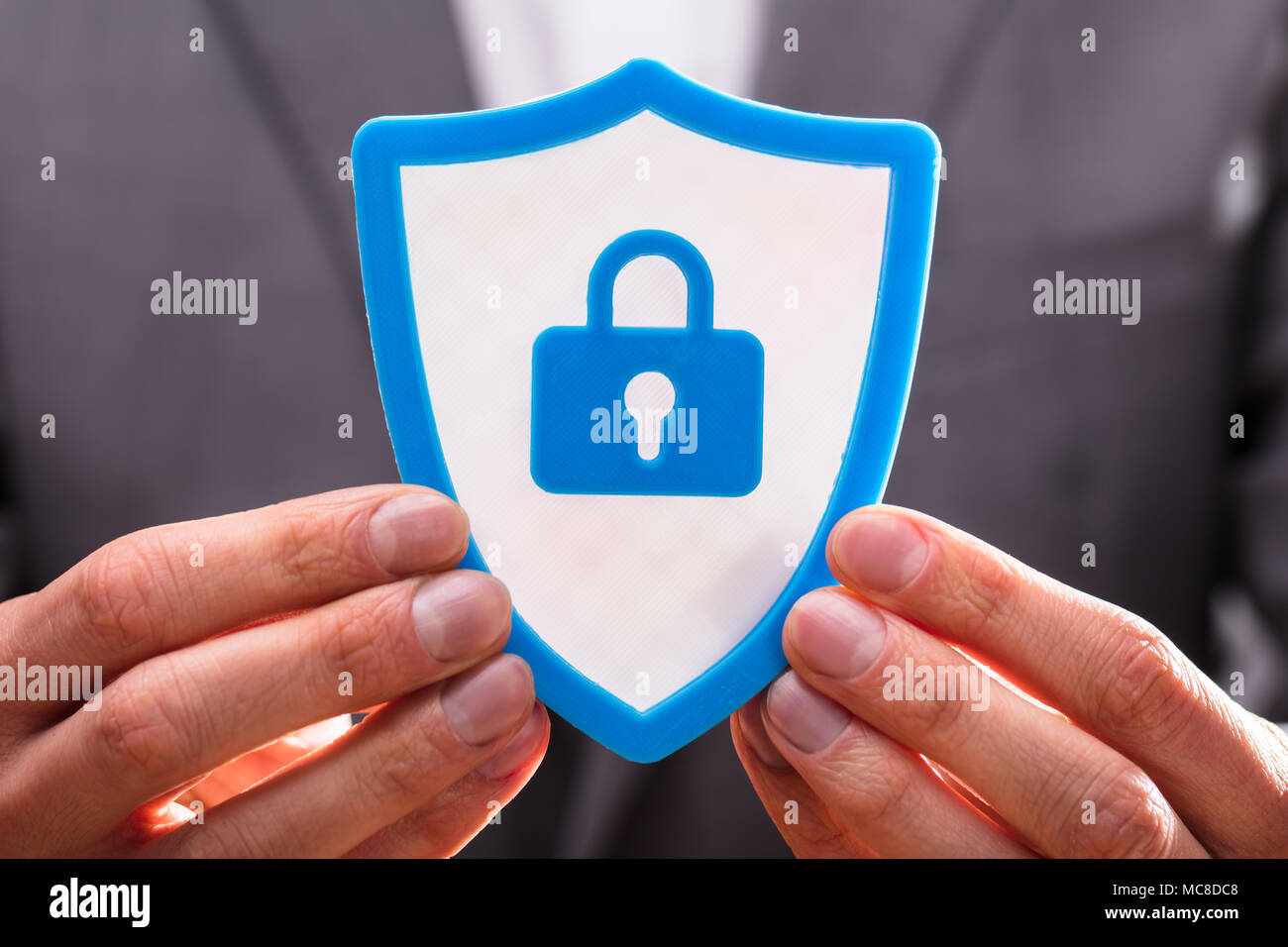 Protection symbol with a shield hi-res stock photography and images - Alamy