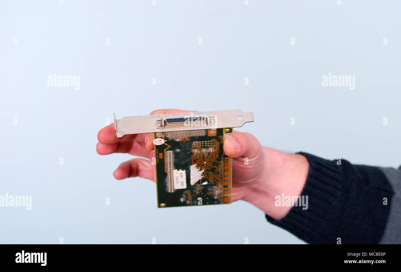 Picture of a male hand hold computer card Stock Photo - Alamy