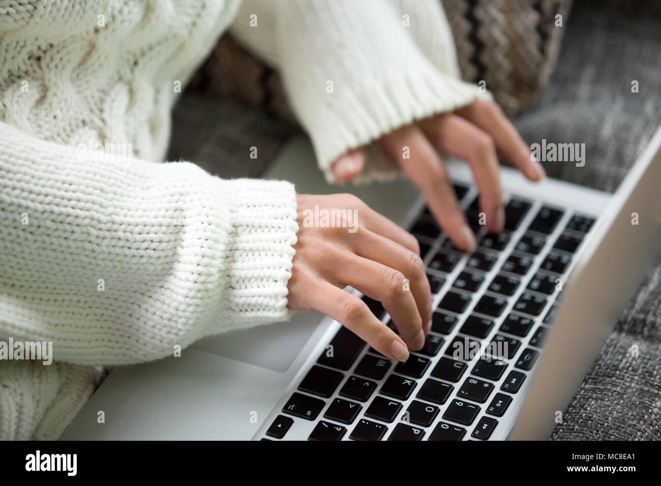 Hands of woman typing on keyboard, teen girl working on computer ...