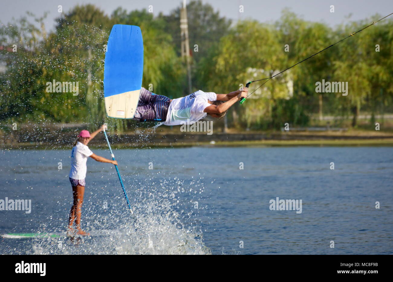 wakeboarder athlete doing wakeboard and wakeboarding jump Stock Photo ...