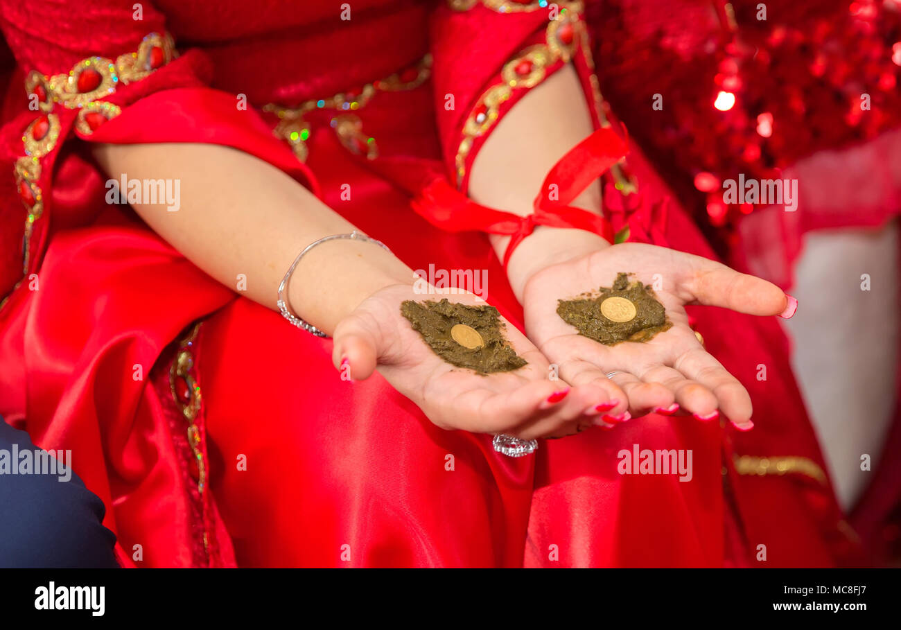 Drawing henna at the Henna party. They put their hands henna of the ...