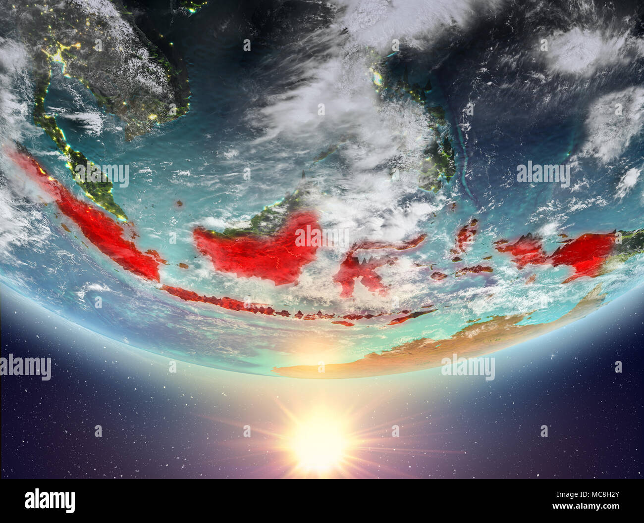 Indonesia during sunrise highlighted in red on planet Earth with clouds ...