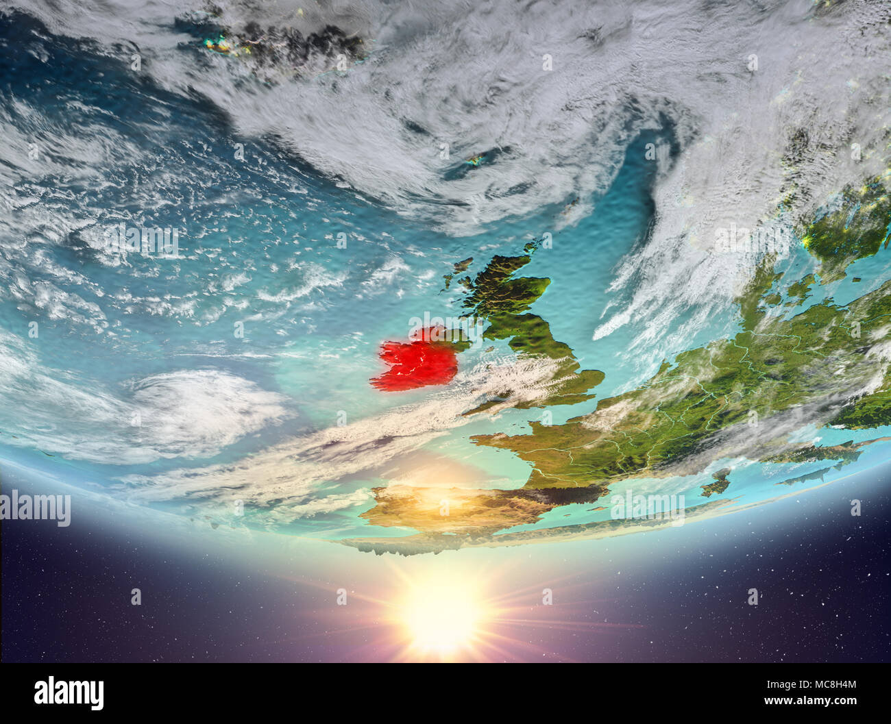 Ireland during sunrise highlighted in red on planet Earth with clouds ...