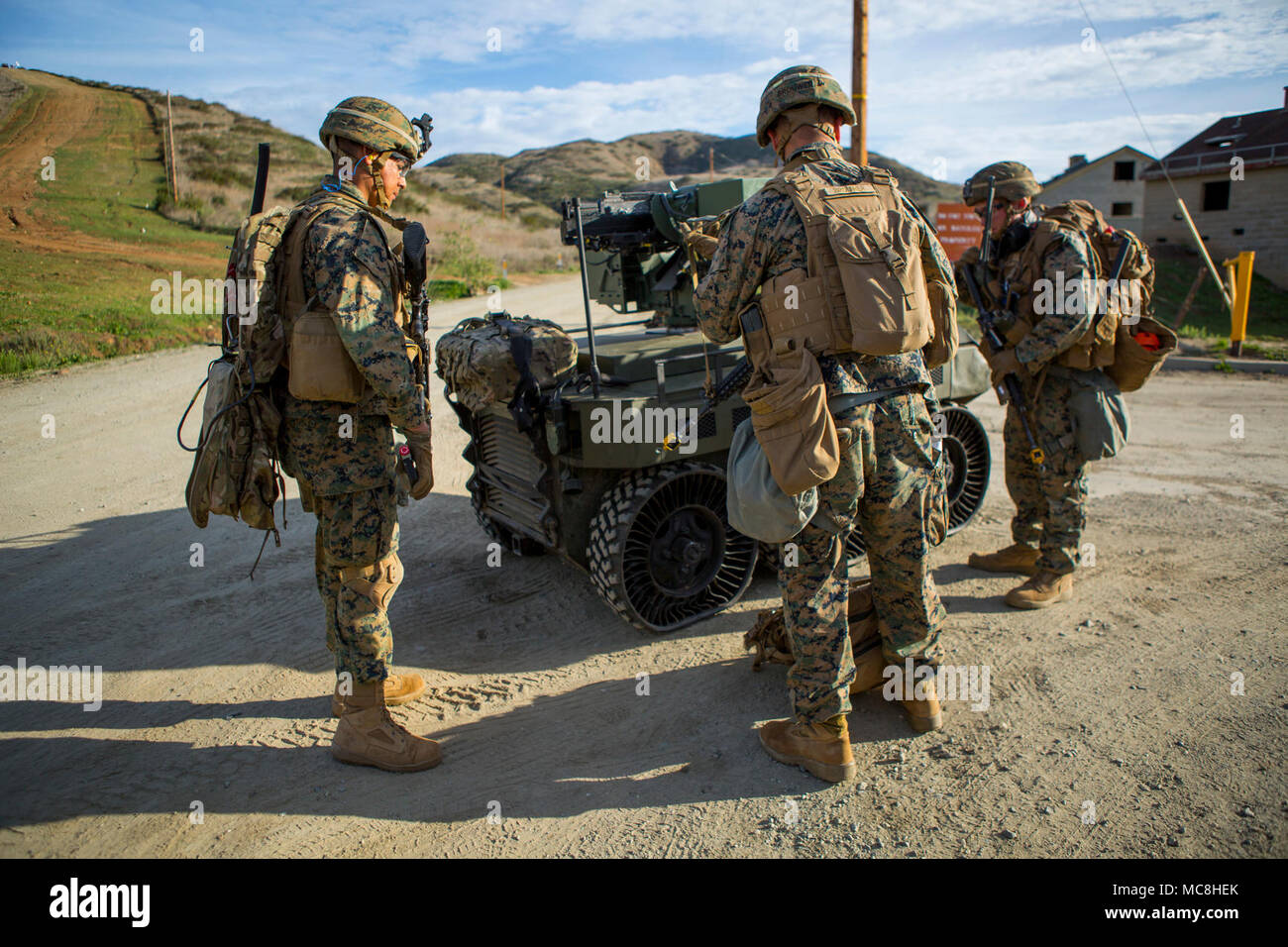 U.S. Marines with 3rd Battalion, 4th Marines, Kilo Company load an ...