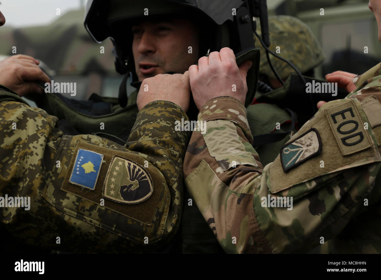 A Soldier from the Kosovo Security Forces (KSF) dons an Explosive Ordnance Disposal (EOD) suit ...