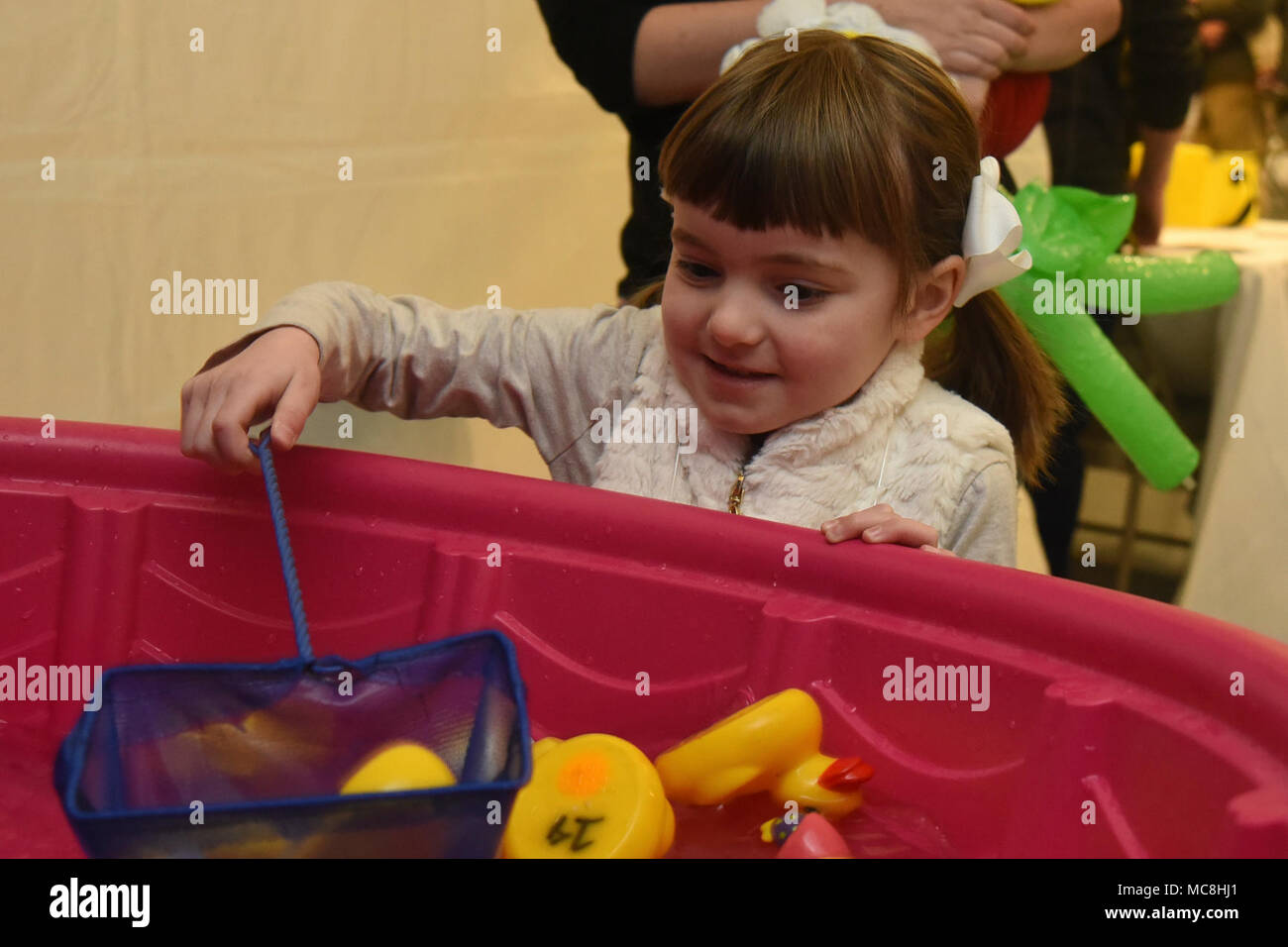 Madison Parrott, 5, fishes for rubber ducks during the 50th Force ...