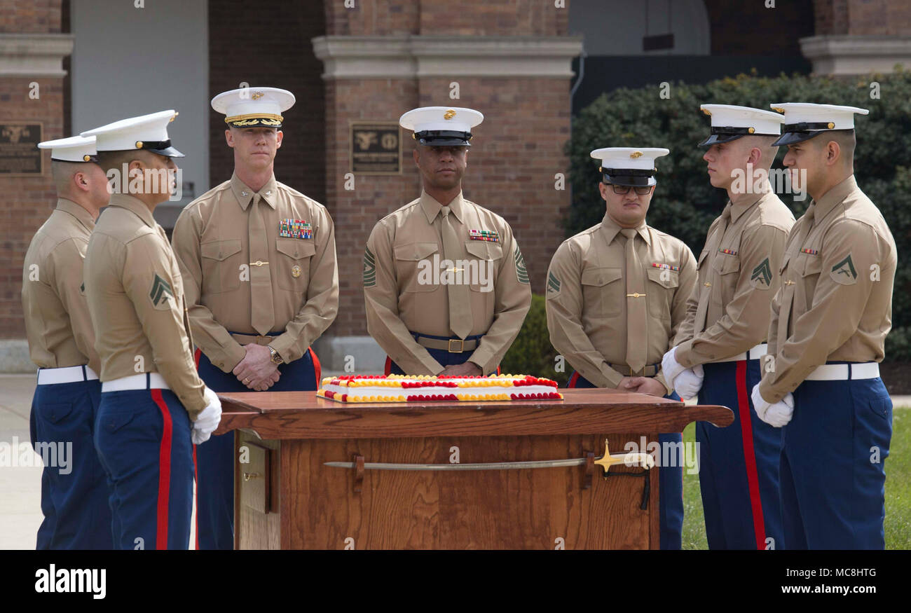 Barracks’ Marines prepare to participate in a cake cutting ceremony as ...