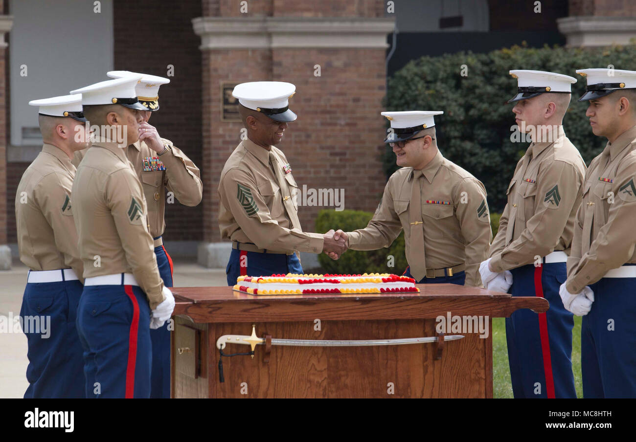 Barracks’ Marines shake hands after each of the Marines shared a piece ...