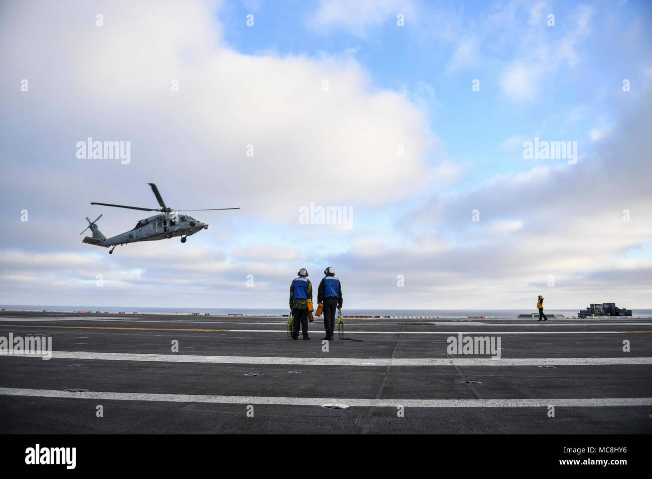 US Navy aircraft carrier, flight deck crew at work Stock Photo - Alamy