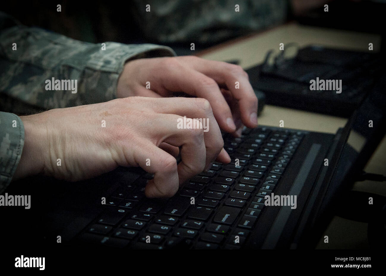 An Airman types on his computer during the Cybersecurity Foundry Course ...
