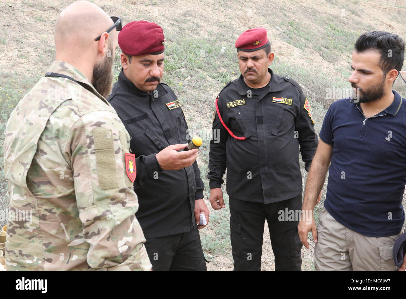 Iraqi Counter Terrorism Services and a Coalition Force member study ...