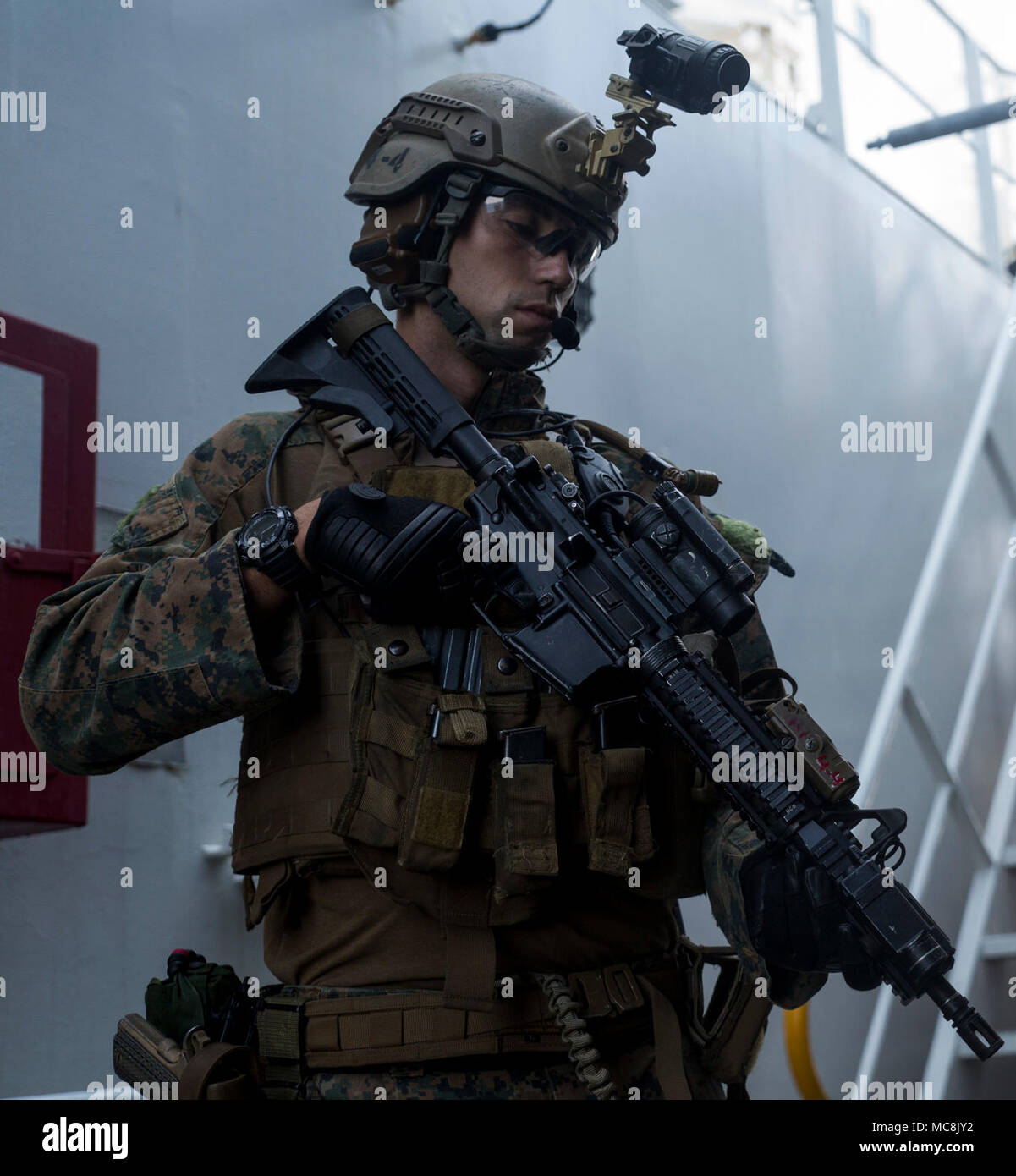 A Force Reconnaissance Marine with Maritime Raid Force, 31st Marine Expeditionary Unit, posts ...