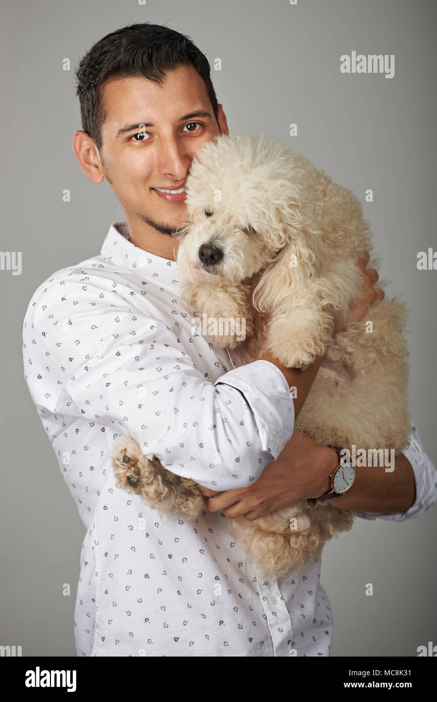 Boy holding pet dog hi-res stock photography and images - Alamy