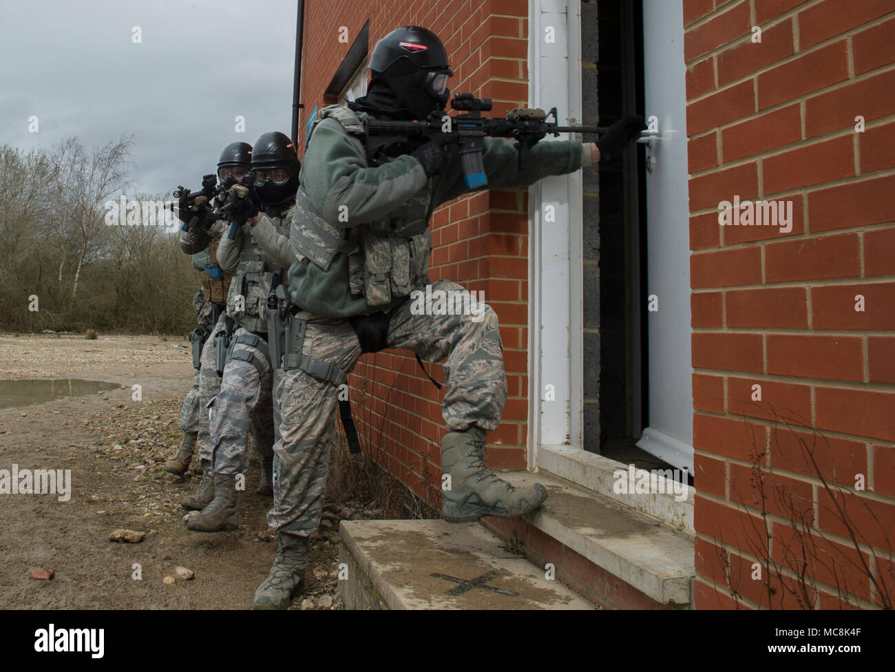 Airmen with the 422nd Security Forces Squadron participate in a force ...