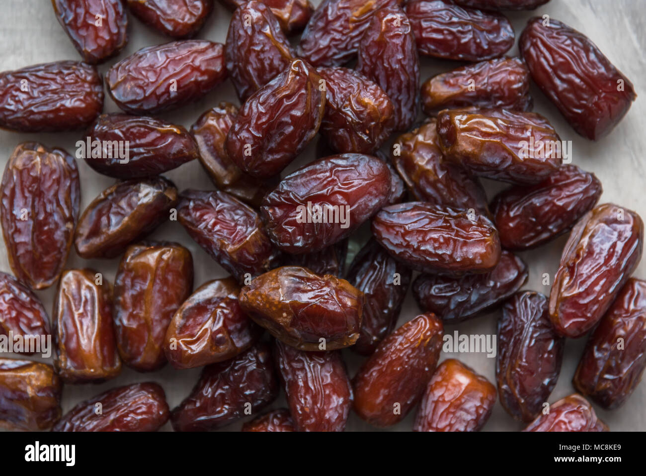 Dried medjool dates full-frame close-up flat lay Stock Photo - Alamy