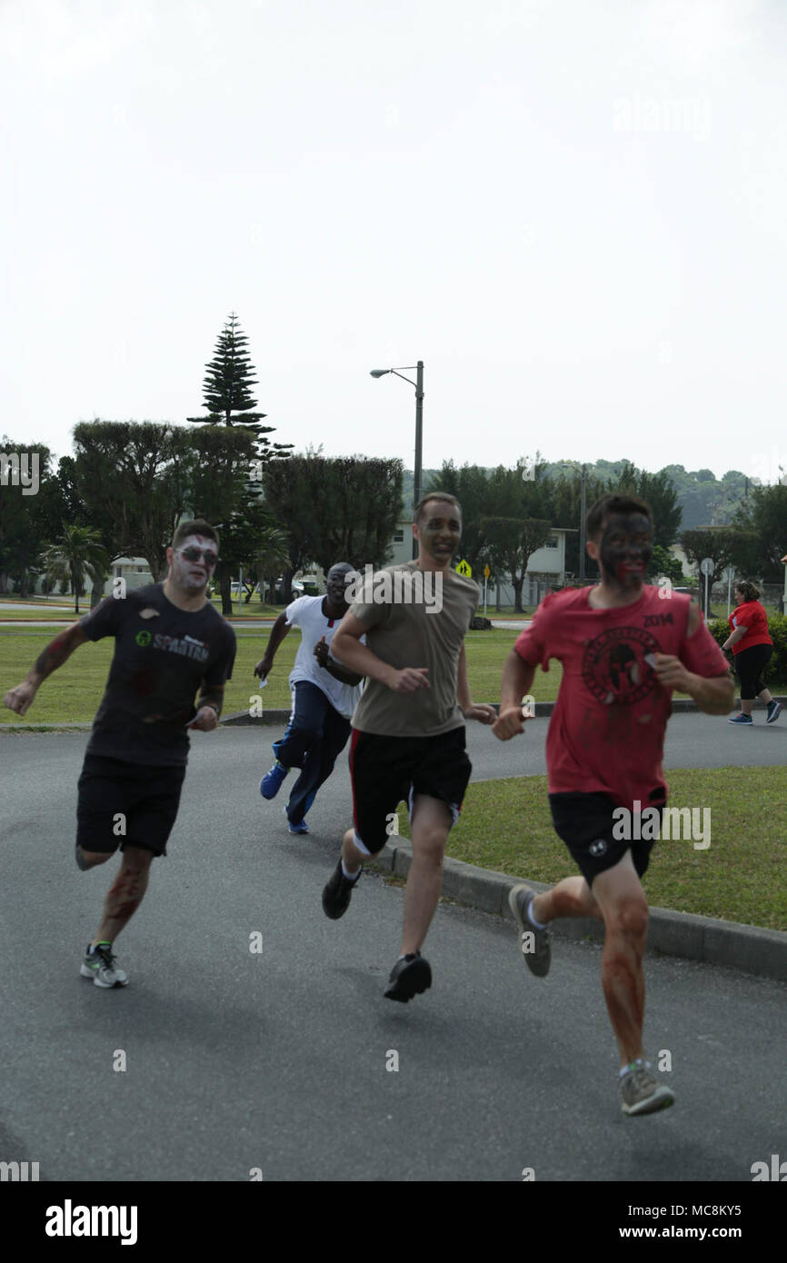 CAMP LESTER, OKINAWA, Japan – The zombie volunteers race after the ...