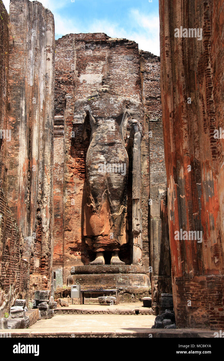 A giant masoned Standing Buddha statue without head in a temple in the ...