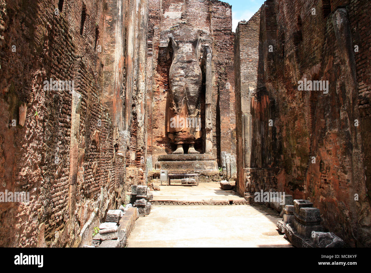 A giant masoned Standing Buddha statue without head in a temple in the ...