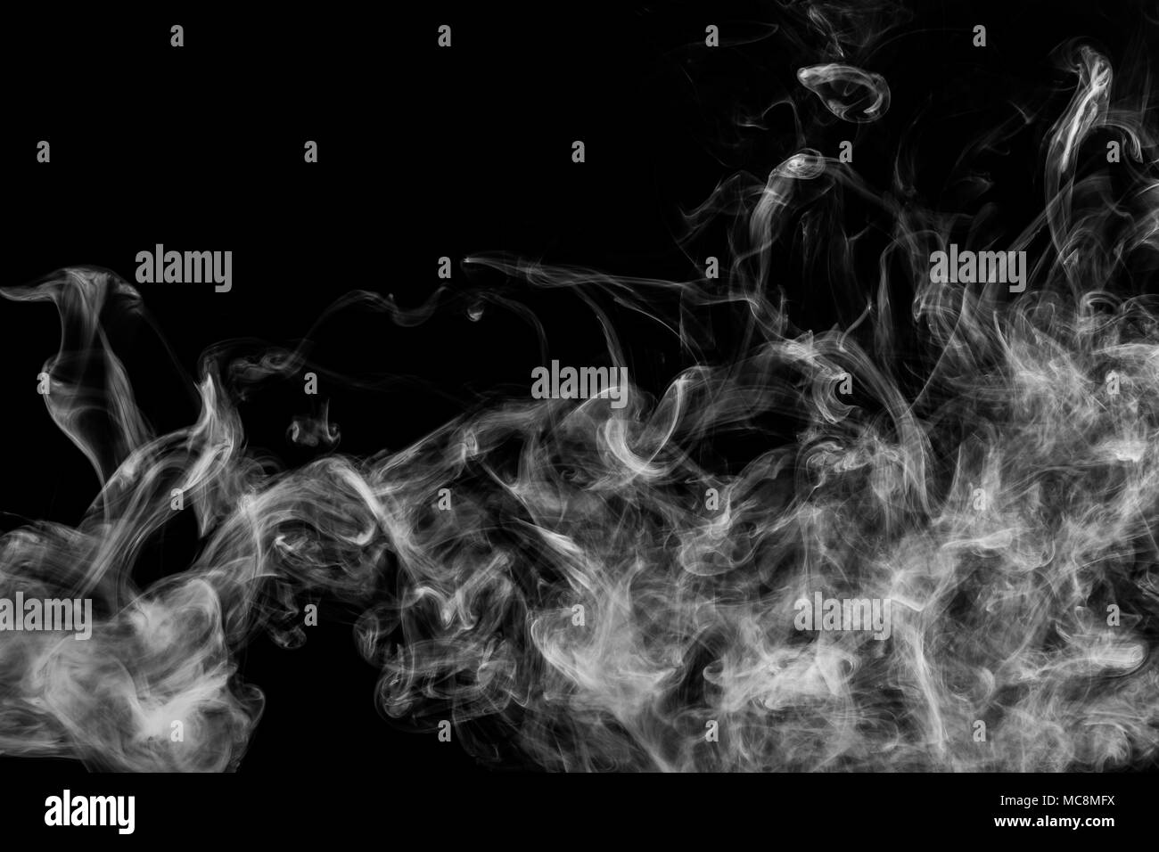 Thick white smoke on a black isolated background. Background from the ...