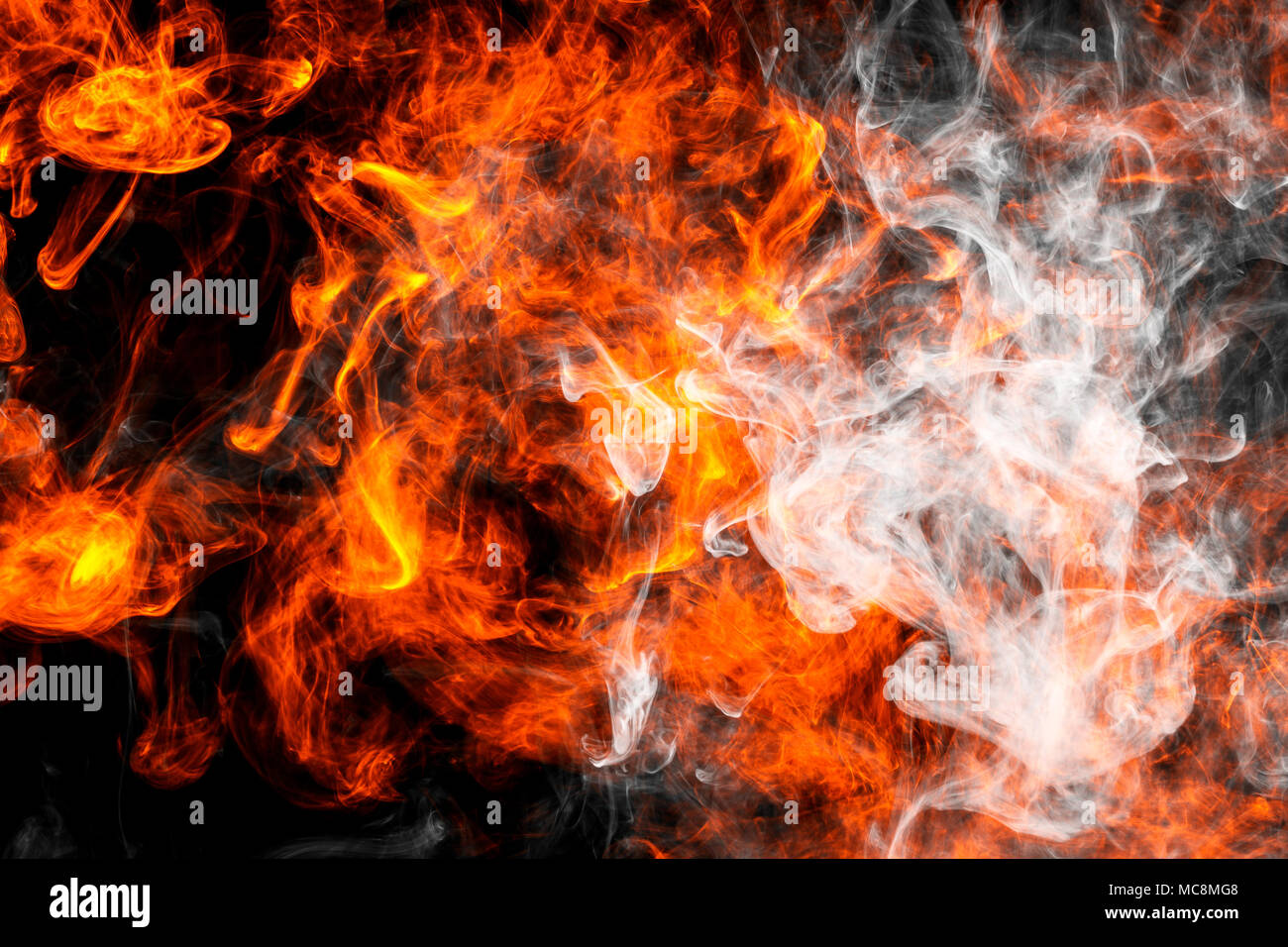 Fire flames background. Dense fiery smoke on a black isolated ...