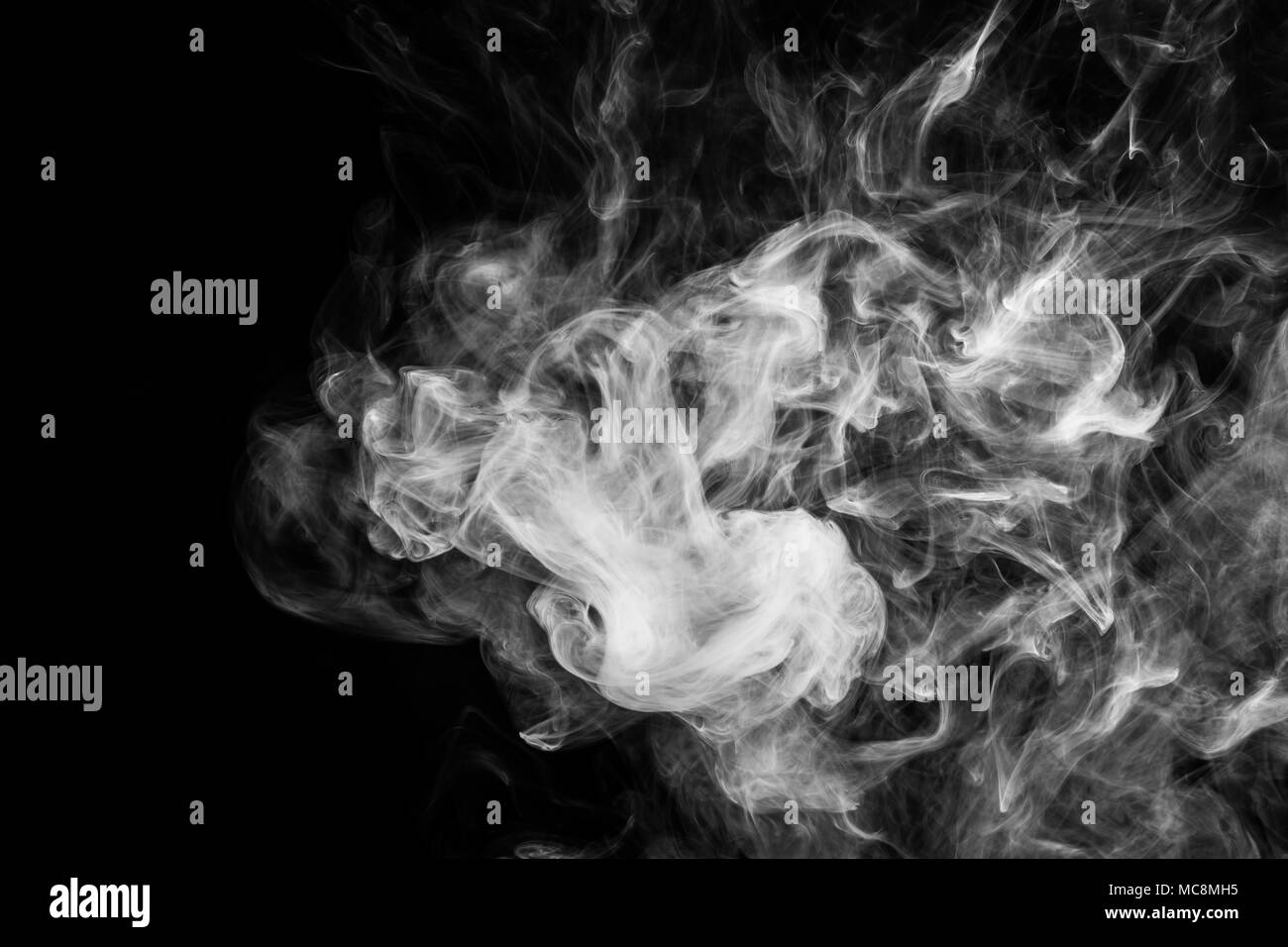 White cloud smoke on black isolated background Stock Photo - Alamy