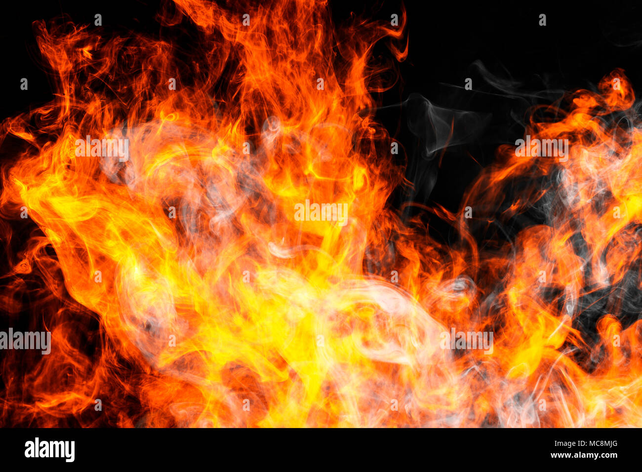 Fire flames background. Colorful fiery smoke on a black isolated ...