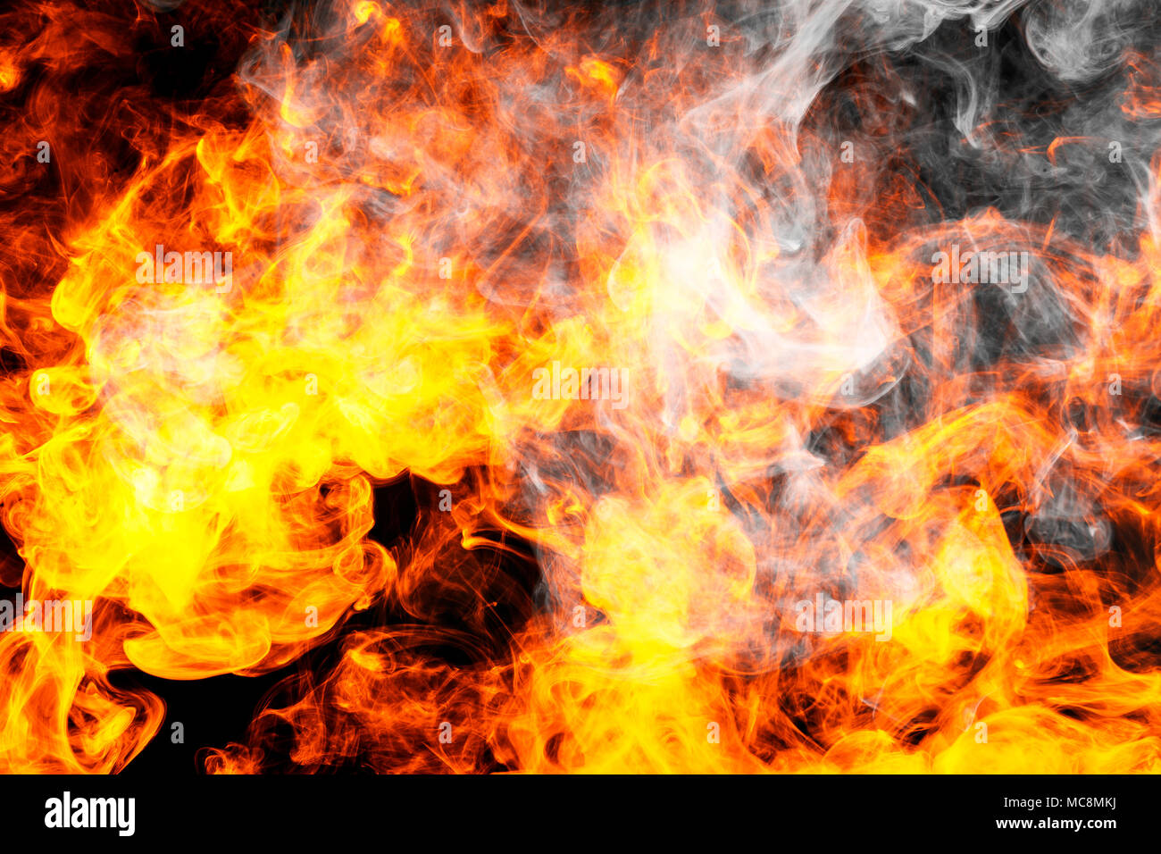 Fire flames background. Colorful fiery smoke on a black isolated ...