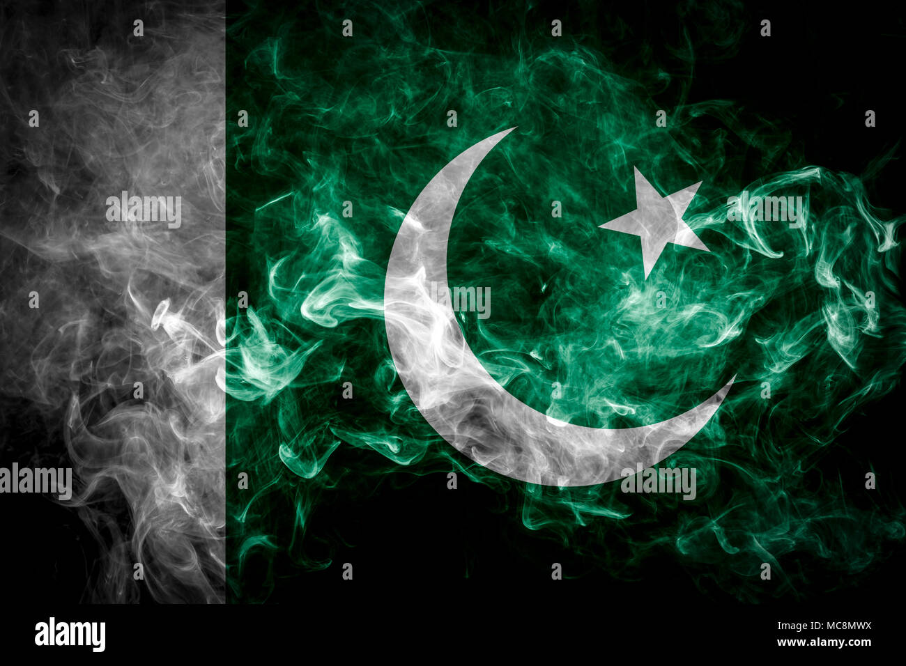 National flag of Pakistan from thick colored smoke on a black isolated ...