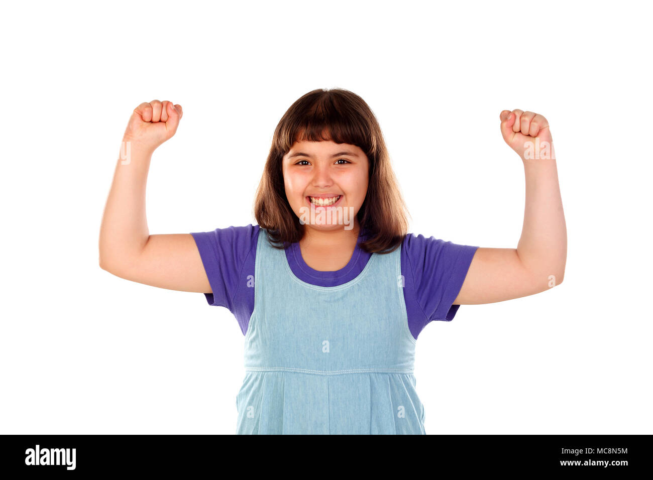 Winner girl celebrating something and raising her arms isolated on a ...