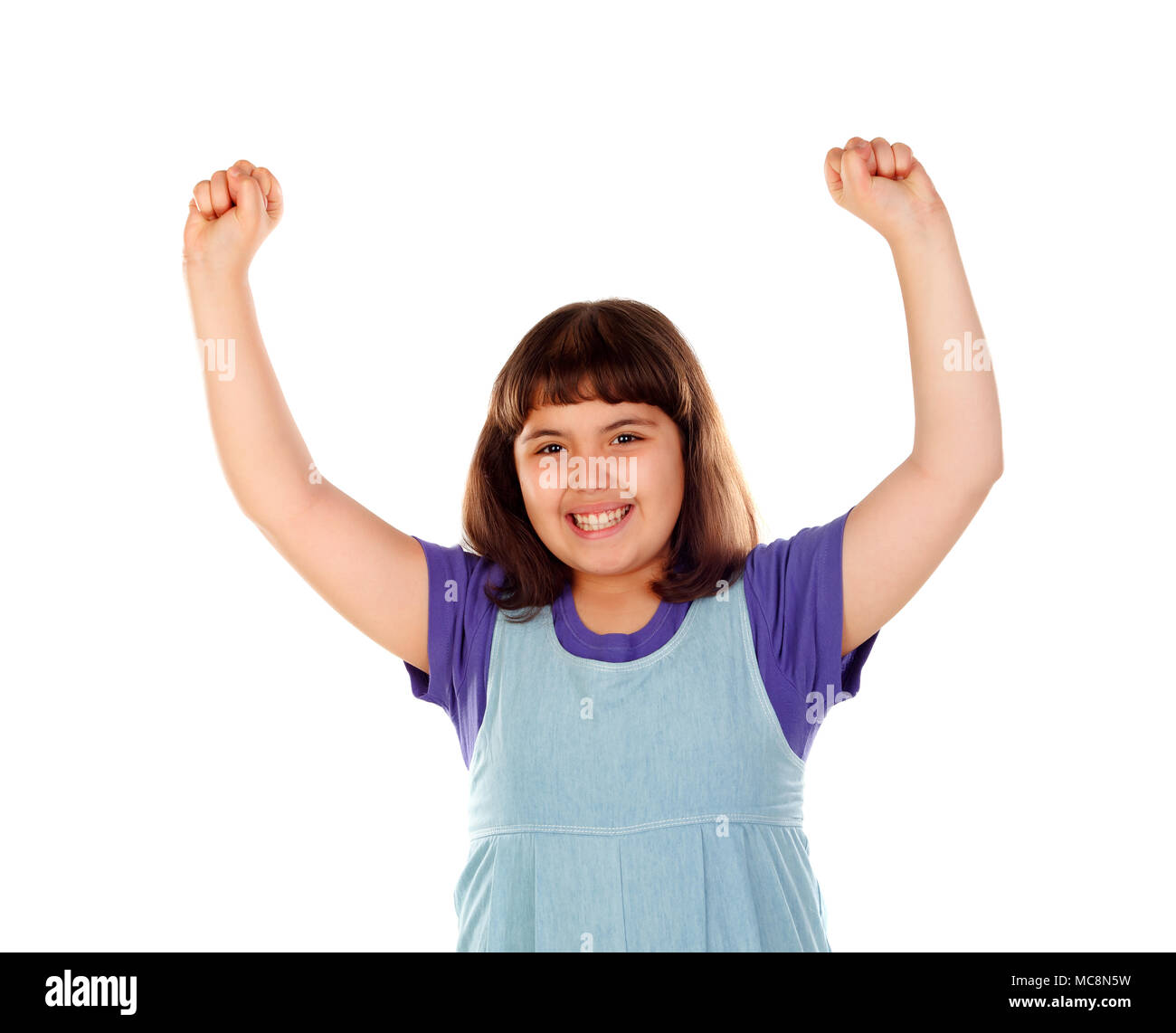 Winner girl celebrating something and raising her arms isolated on a ...