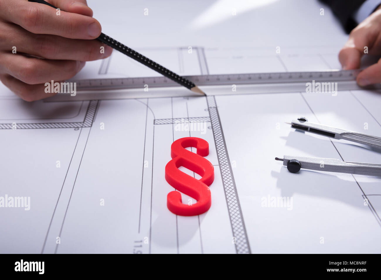 Close-up Of Red Paragraph Symbol In Front Of Architect's Hand Working ...