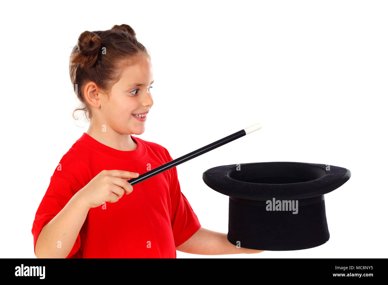 Pretty little girl doing magic with a top hat and a magic wand isolated ...