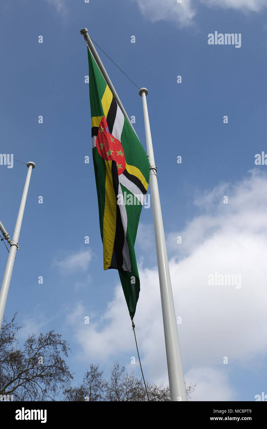 The flag of Dominica flies with other flags from countries of the ...