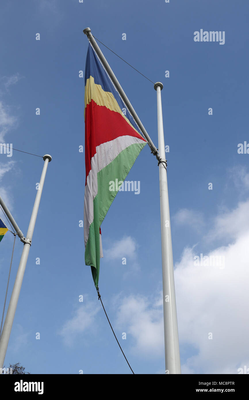 The flag of Seychelles flies with other flags from countries of the ...