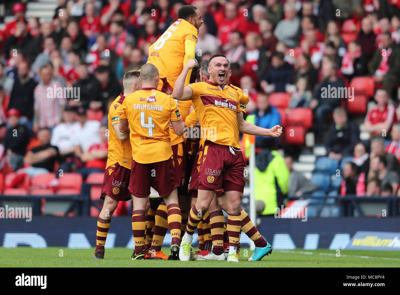 Motherwell's Tom Aldred celebrates after Curtis Main (hidden) scores ...