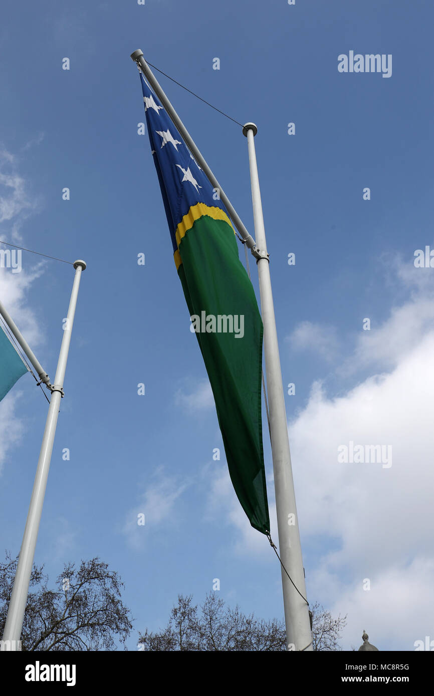 The flag of Solomon Islands flies with other flags from countries of ...