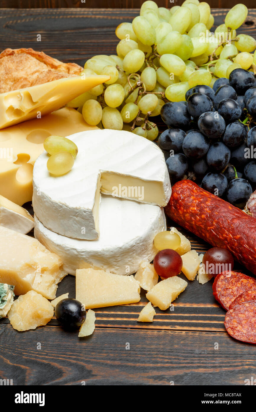 Traditional italian products with salami, cheese, bread and fruits ...
