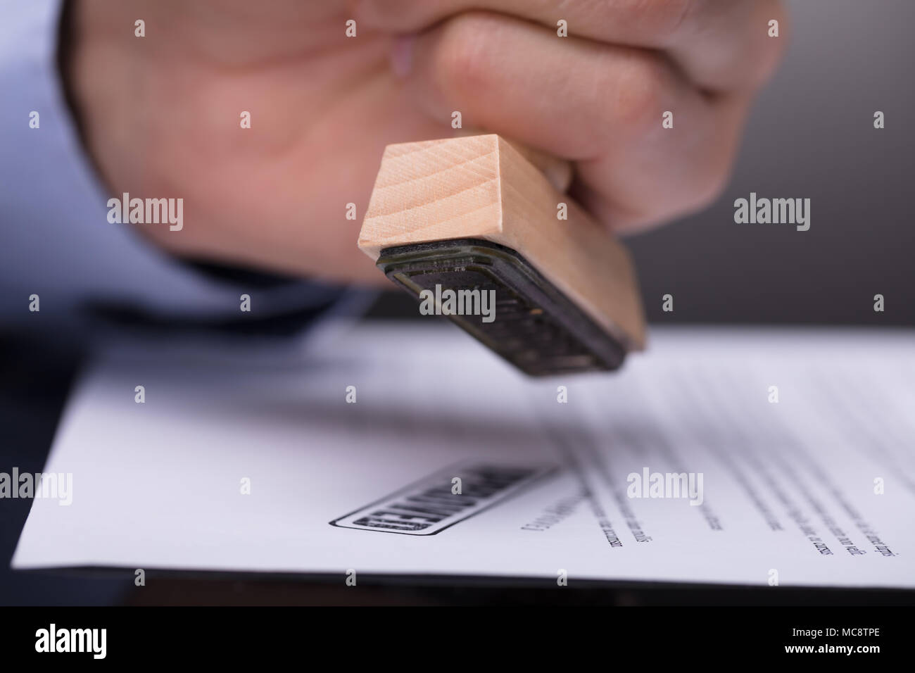 Businessperson stamping document hi-res stock photography and images ...