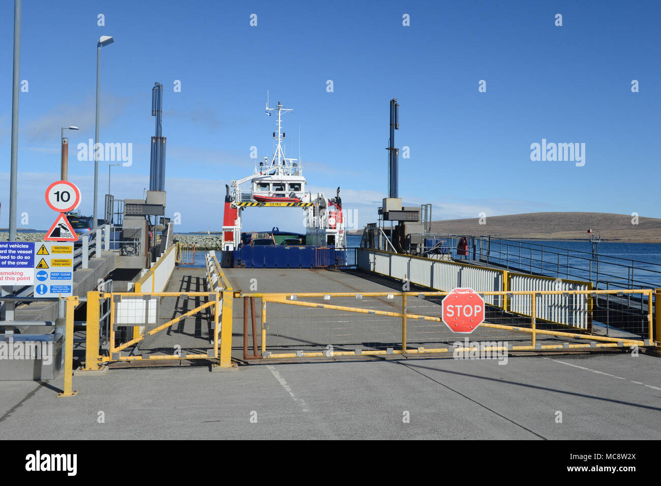 Ferry arriving at the ferry terminal on Fetlar one of Shetland's remote ...