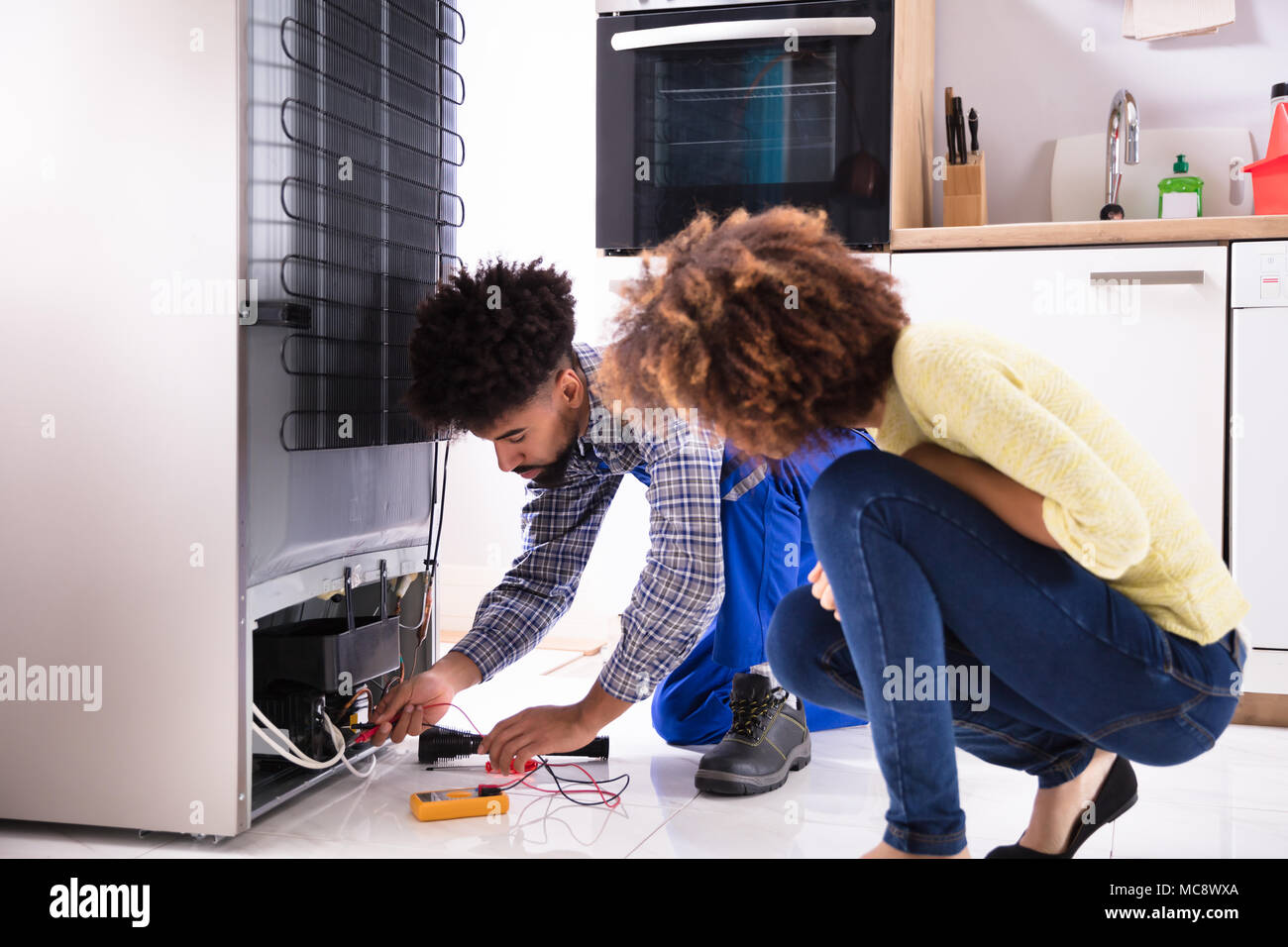 Woman bending into fridge hi-res stock photography and images - Alamy