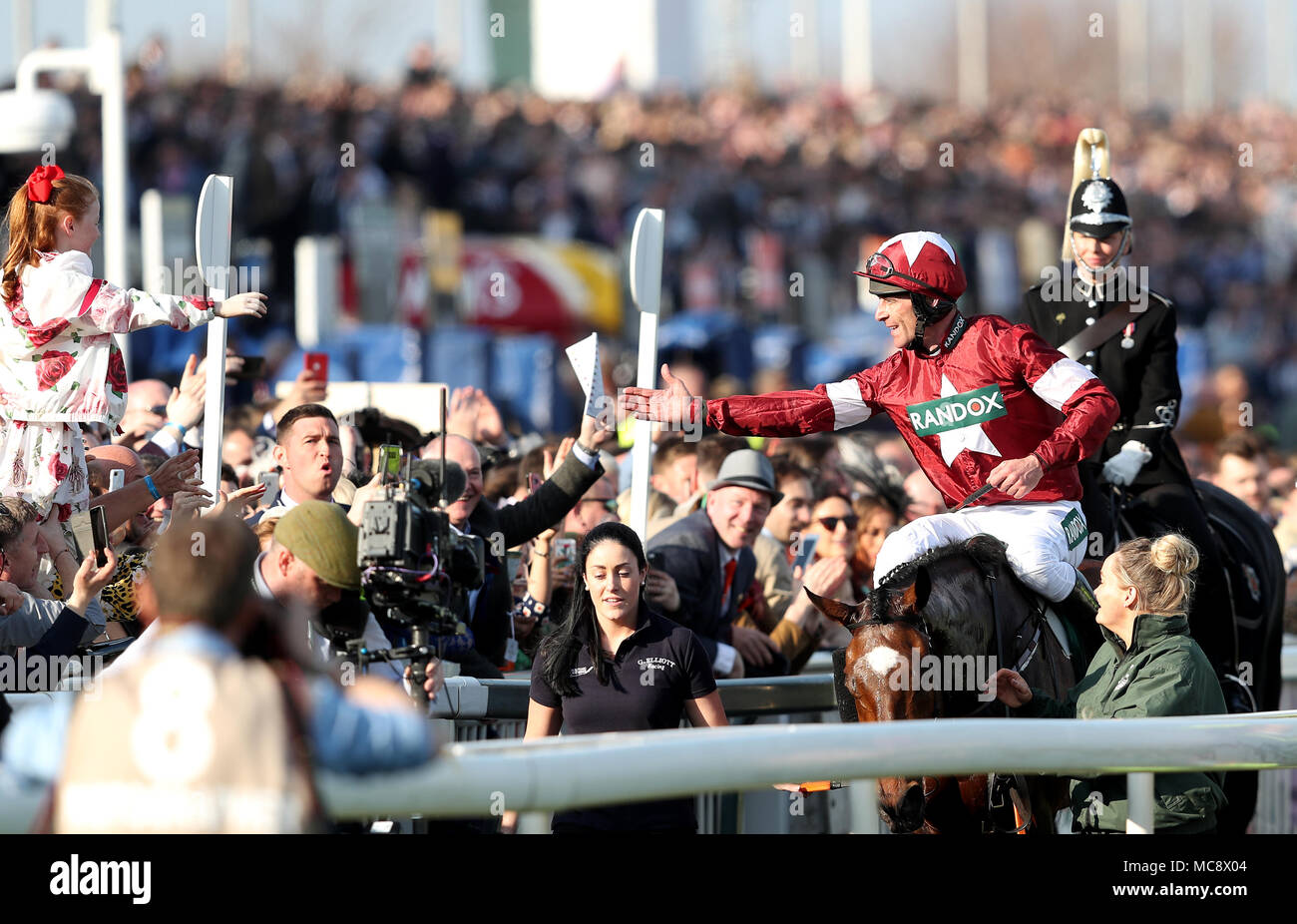 Jockey Davy Russell on Tiger Roll celebrates winning the Randox Health ...