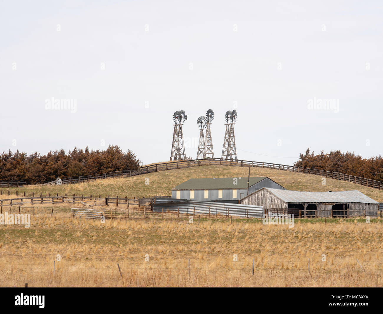 Windmills dot the skyline on a ranch in western Nebraska, north of ...