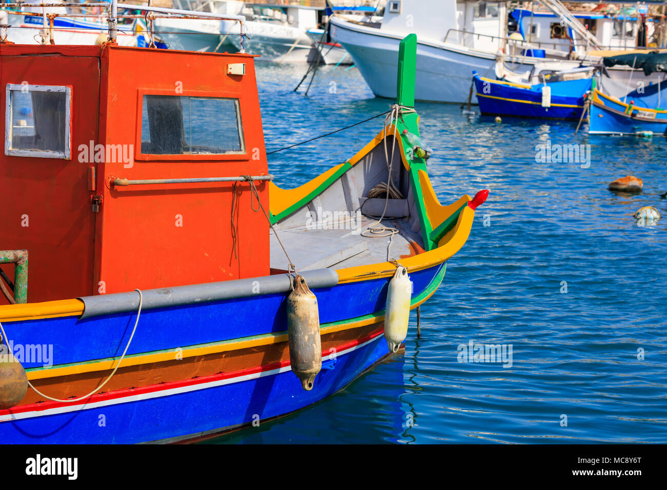 Traditional colorful boat luzzu detail at the port of Marsaxlokk, Malta ...