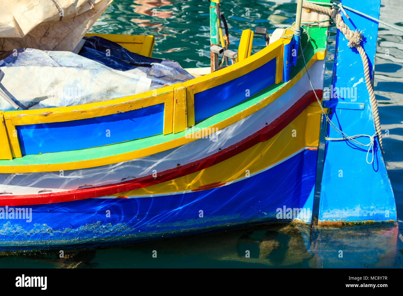 Traditional colorful boat luzzu detail at the port of Marsaxlokk, Malta ...