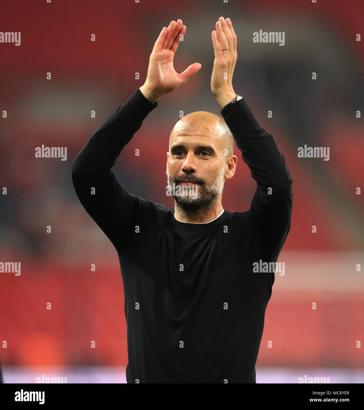 Manchester City's Manager Pep Guardiola applauds the fans after the ...