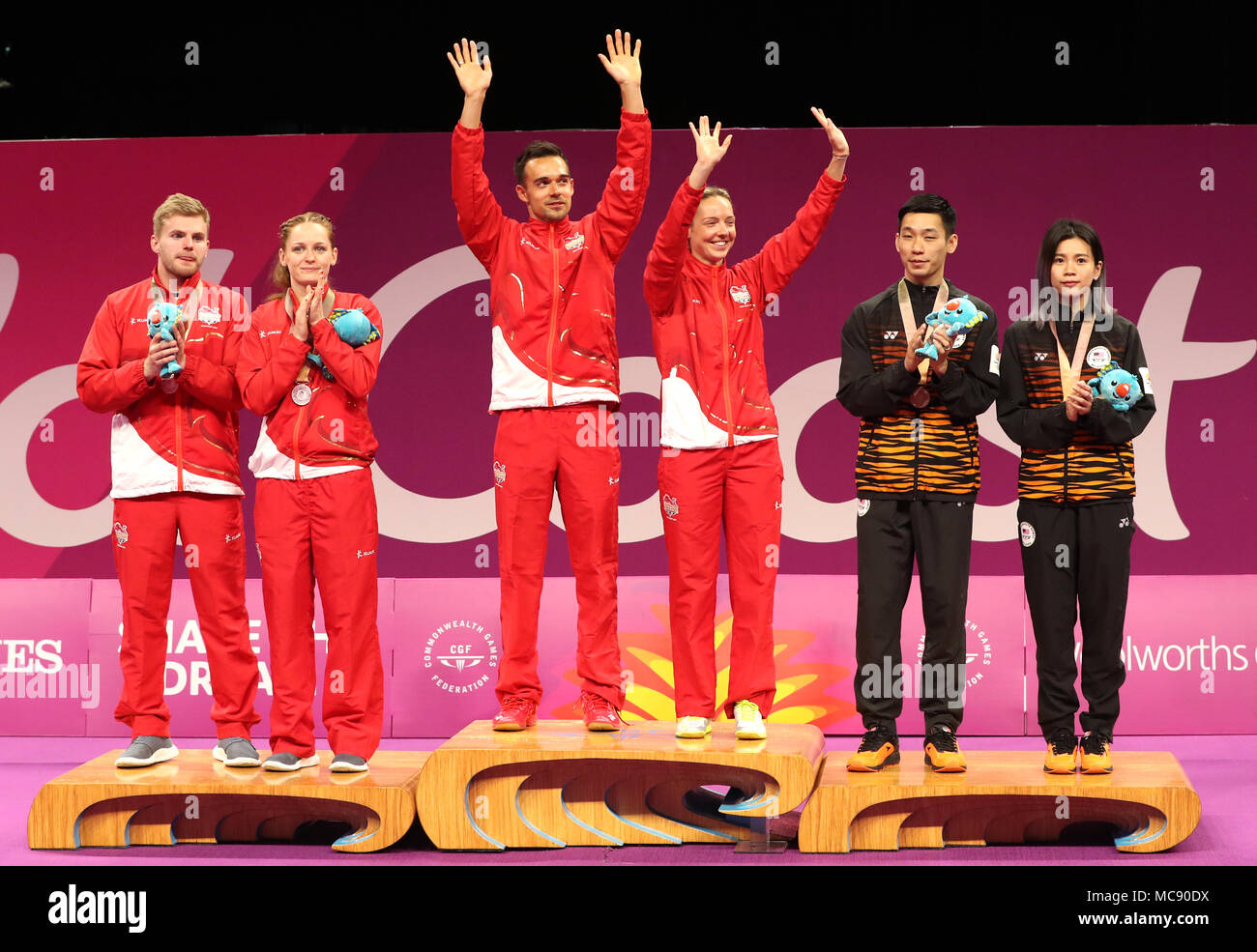 On the podium (left-right) England's Marcus Ellis and Lauren Smith ...