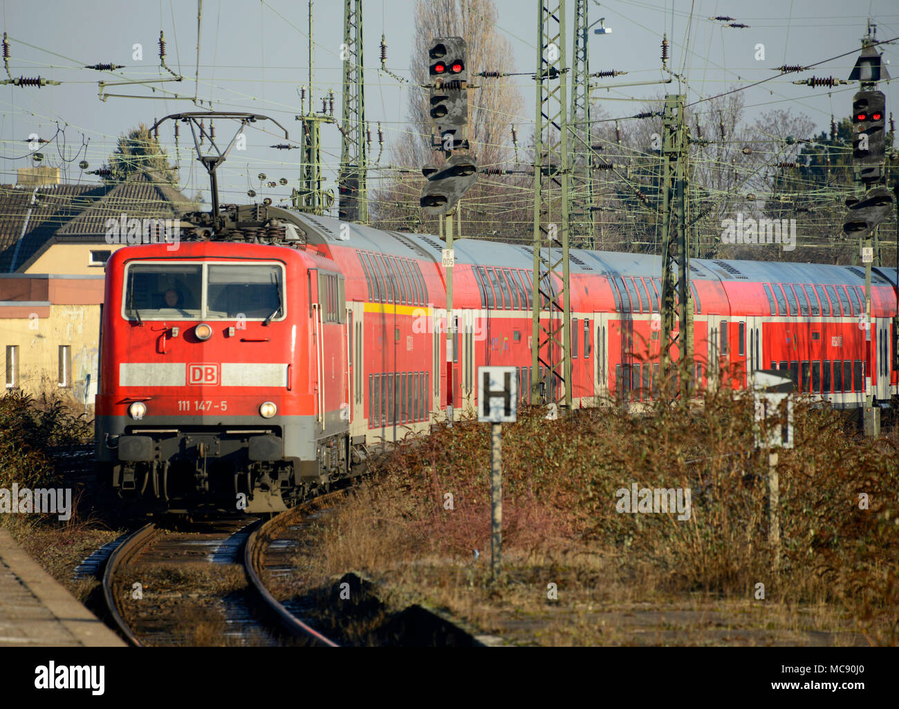 A DB service hauled by a class 111 locomotive approaches ...