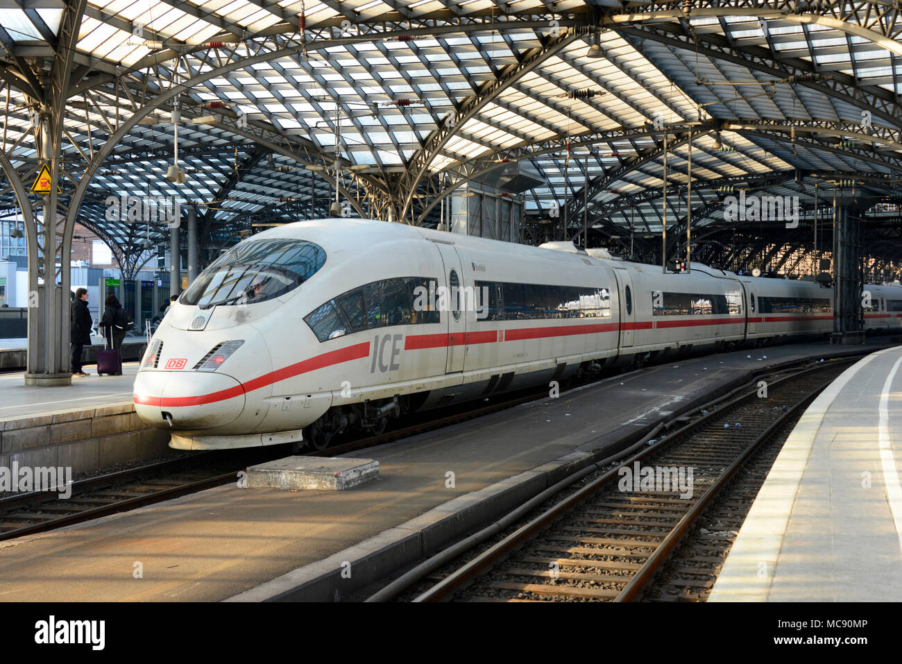 An ICE 3 electric train under the canopy at Cologne station in Gerrmany ...