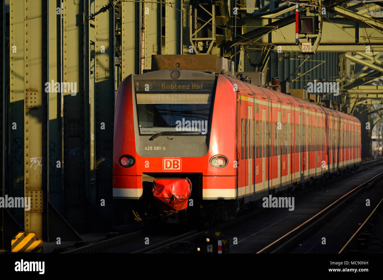 A DB class 425 EMU crosses the Rhine Hohenzollern bridge in Cologne ...