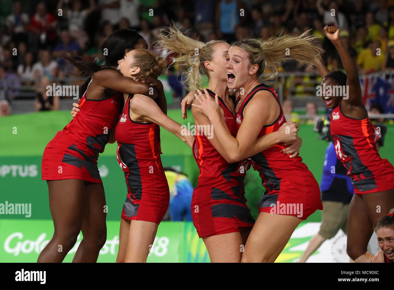 England players celebrate winning gold in the Women's Netball at the ...